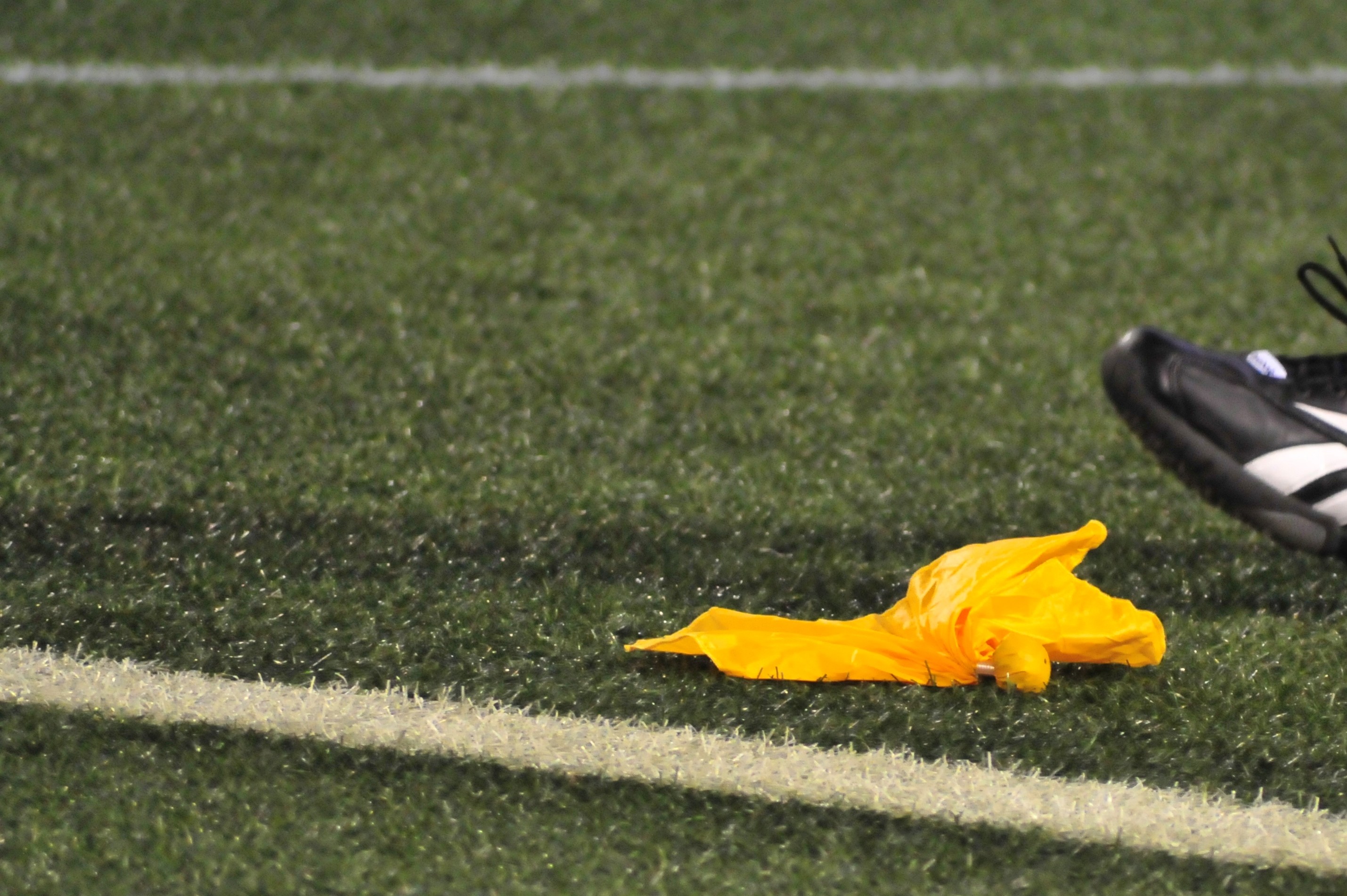Flopping for flag can flip flag in face of flopper – Football Zebras